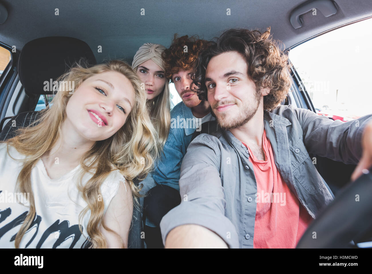 Friends taking selfie in car Stock Photo - Alamy