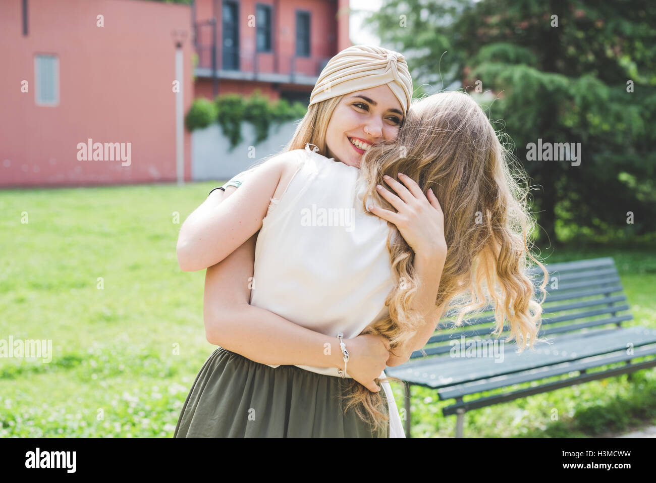 Three friends hugging hi-res stock photography and images - Alamy