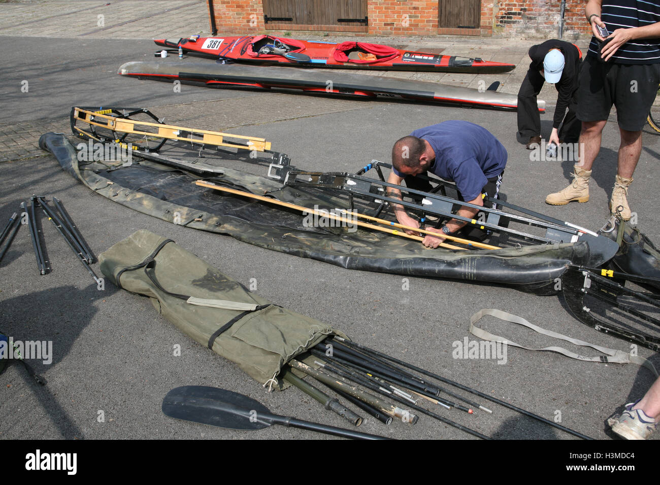 Putting together Klepper kayak. Heavy craft compared to modern ...