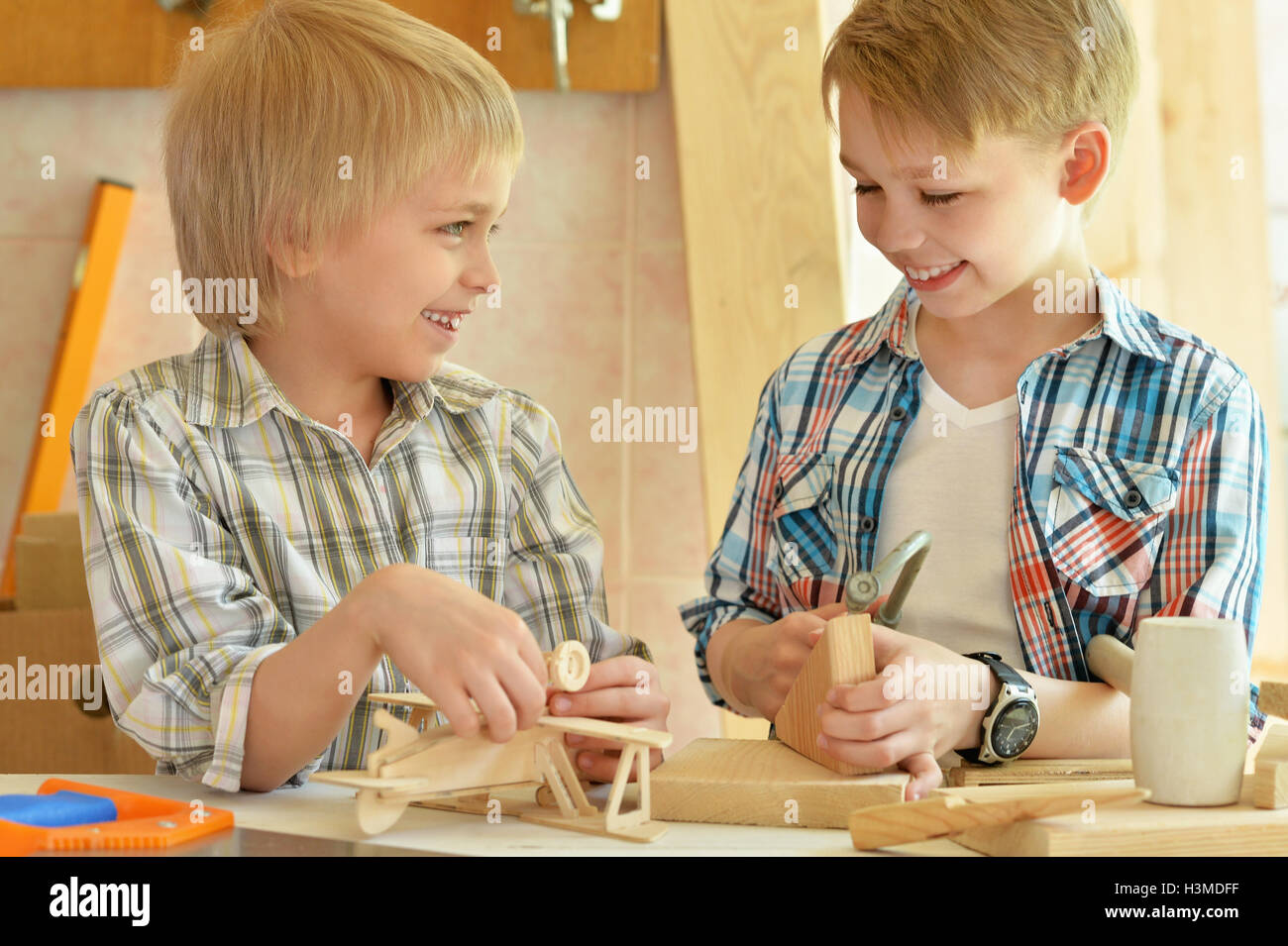 boys working with wood in workshop Stock Photo - Alamy