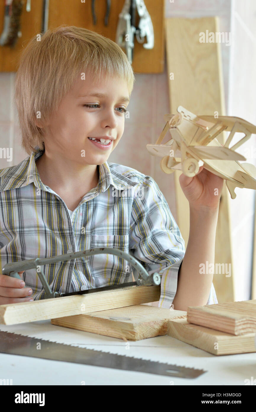 little boy working with wood Stock Photo - Alamy