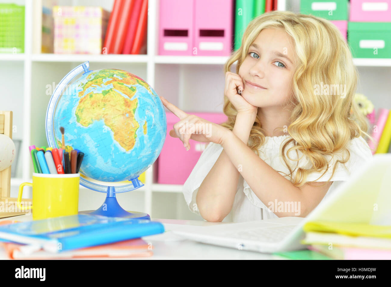 student girl with books and laptop Stock Photo - Alamy