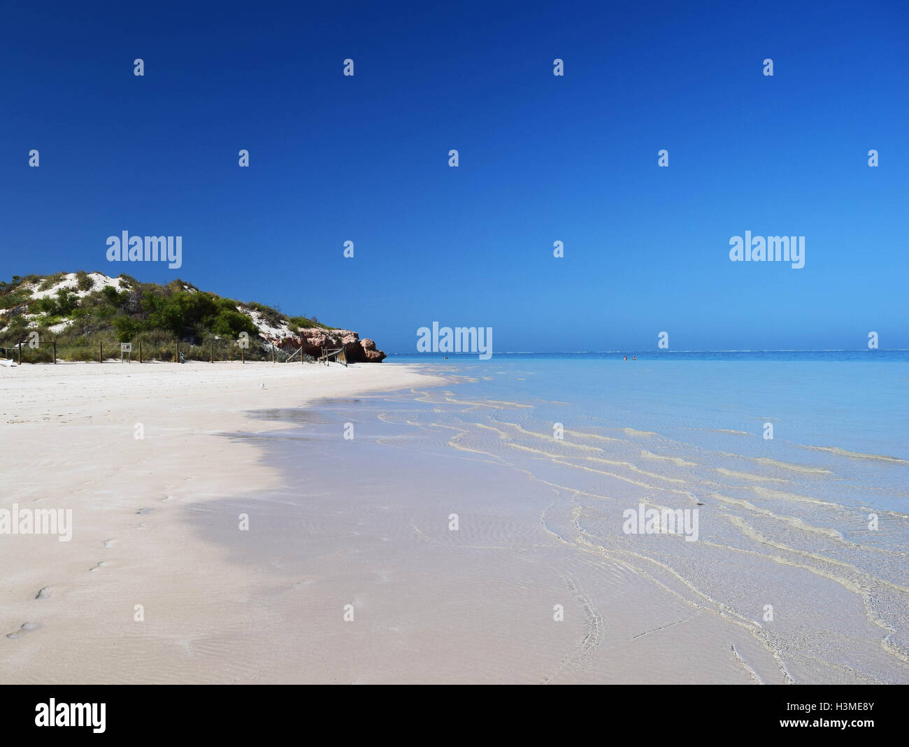 Beautiful sandy beach and clear blue sky Stock Photo - Alamy