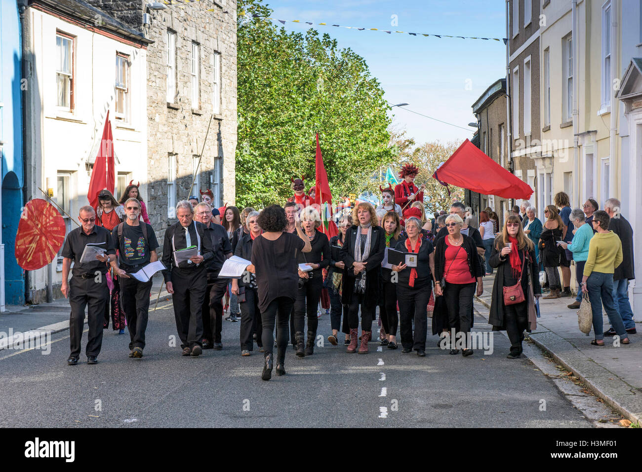 The Suitcase Singers lead the procession during the Penryn Festival in ...