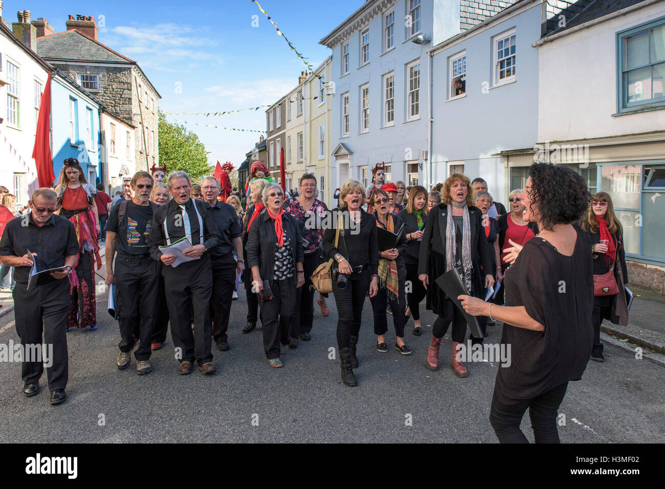 The Suitcase Singers lead the procession during the Penryn Festival in ...