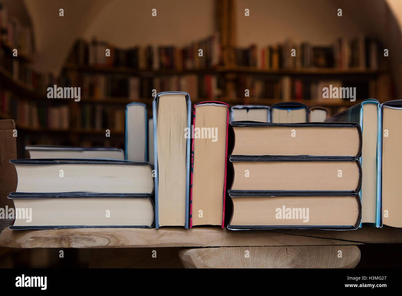 Hardcover books back edges on wooden shelves display of retail book ...
