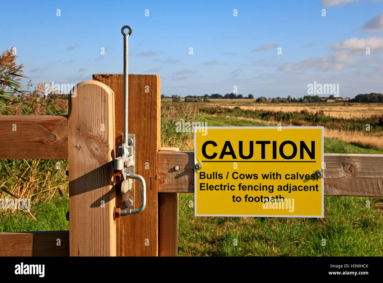 Caution sign on public footpath gateway by the River Bure at Clippesby ...