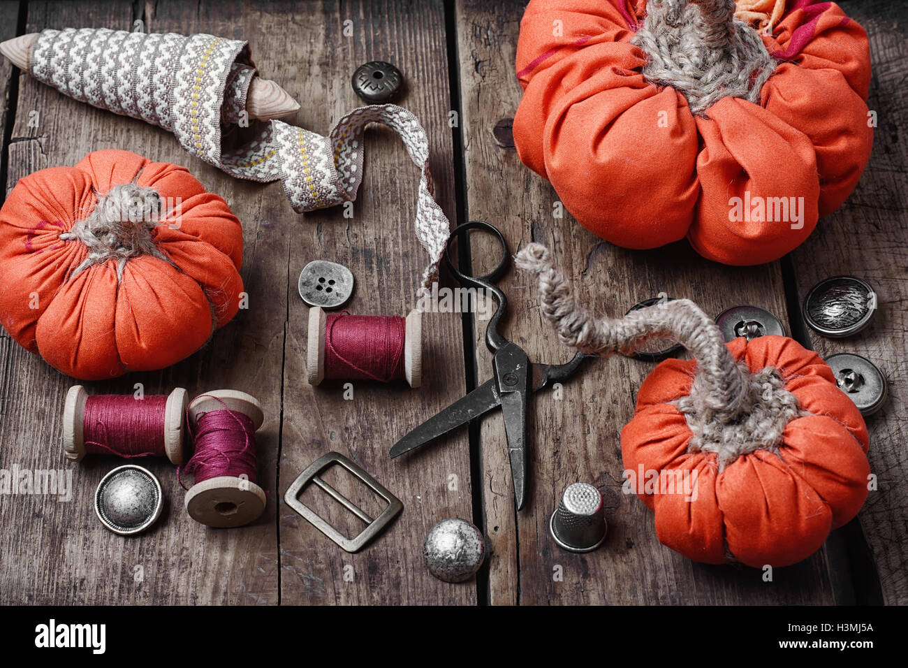Sewing pumpkins from fabric for autumn decorations Stock Photo - Alamy