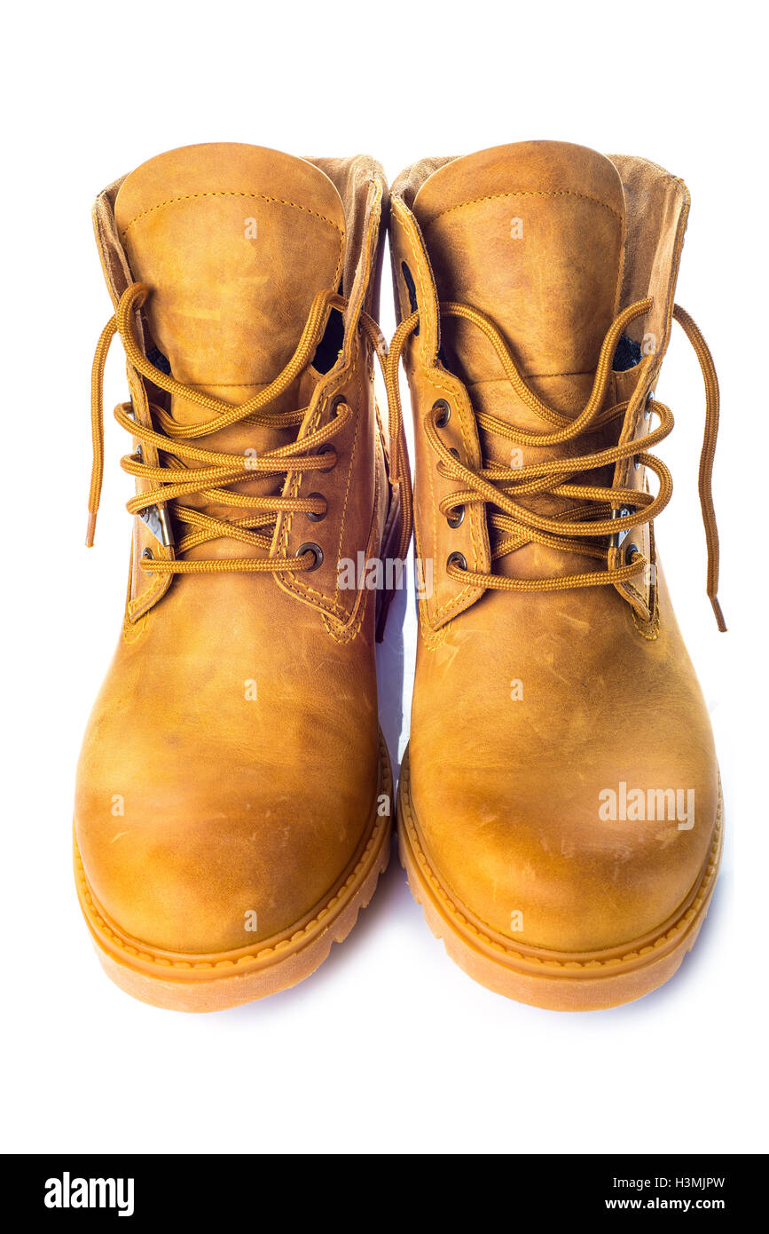 A pair of yellow leather boots isolated on a white background Stock ...