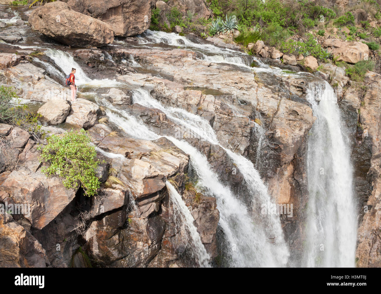Female hiker near mountain waterfall on Gran Canaria, Canary Islands ...
