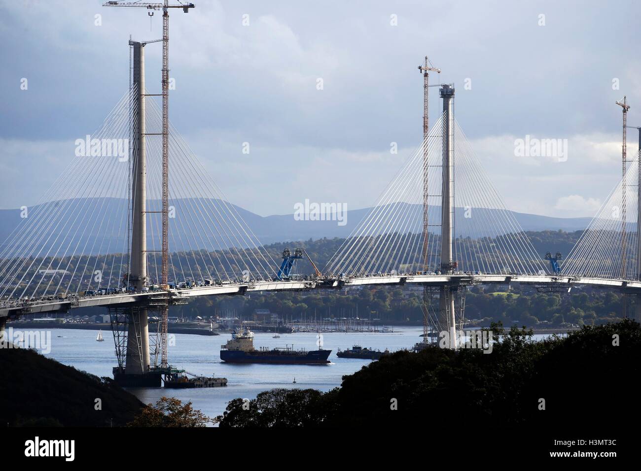 A cargo ship passes underneath the gap between the centre and north ...