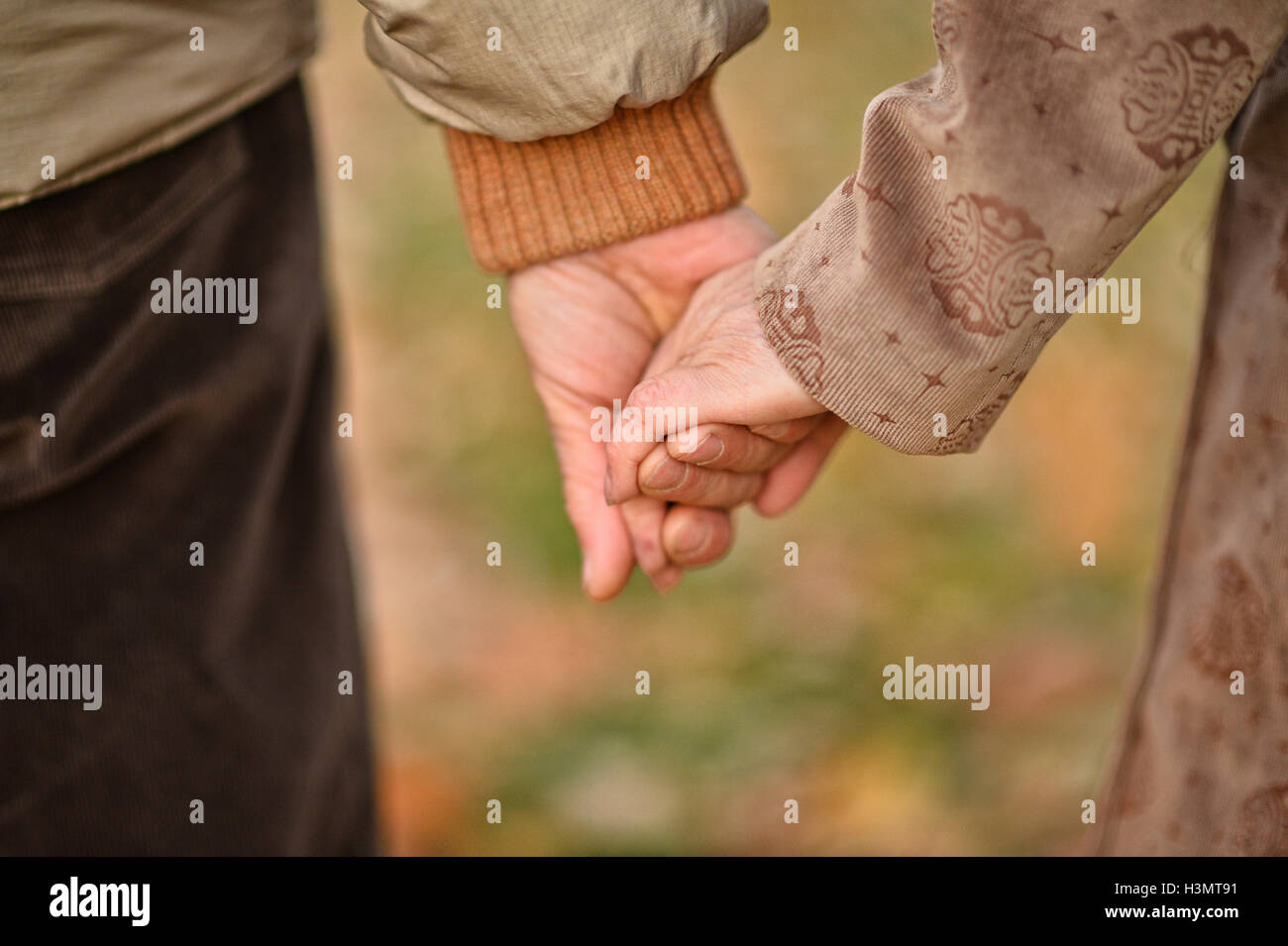 Couple of hands together Stock Photo - Alamy