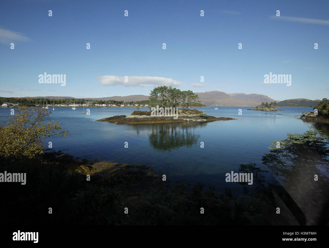 A view of Sgeir Bhuidhe, an outcrop in Loch Carron, from the village of ...