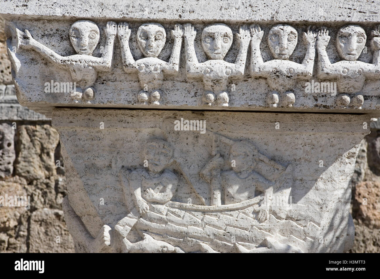 Ancient stone carvings outside the church of Santi Giusto e Clemente ...