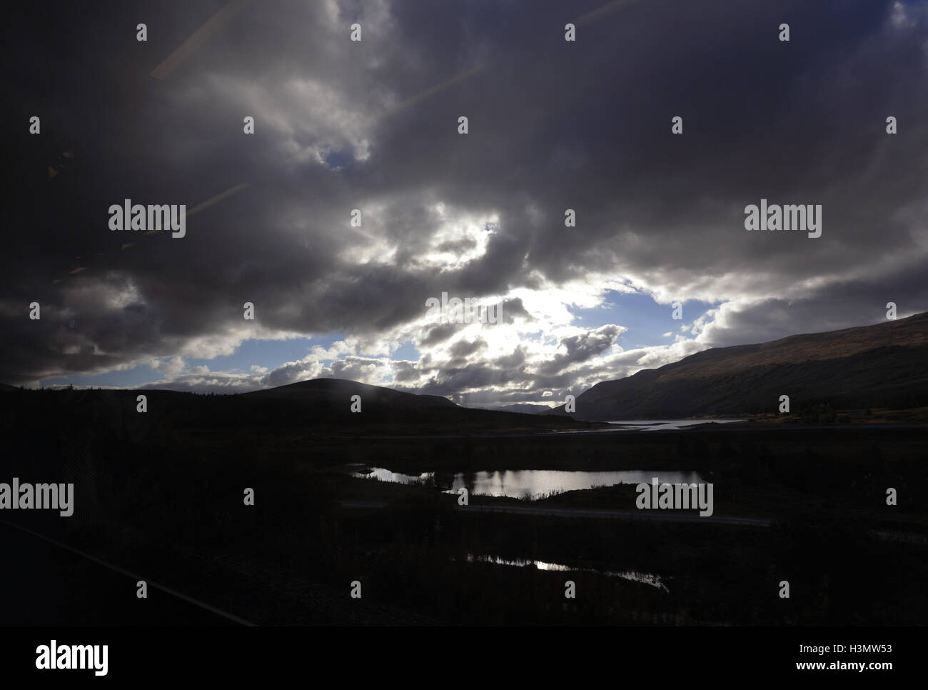 A view of dramatic clouds over the Highlands from the window of an ...