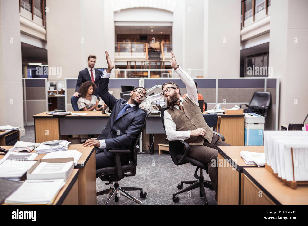 Two businessmen high fiving hi-res stock photography and images - Alamy
