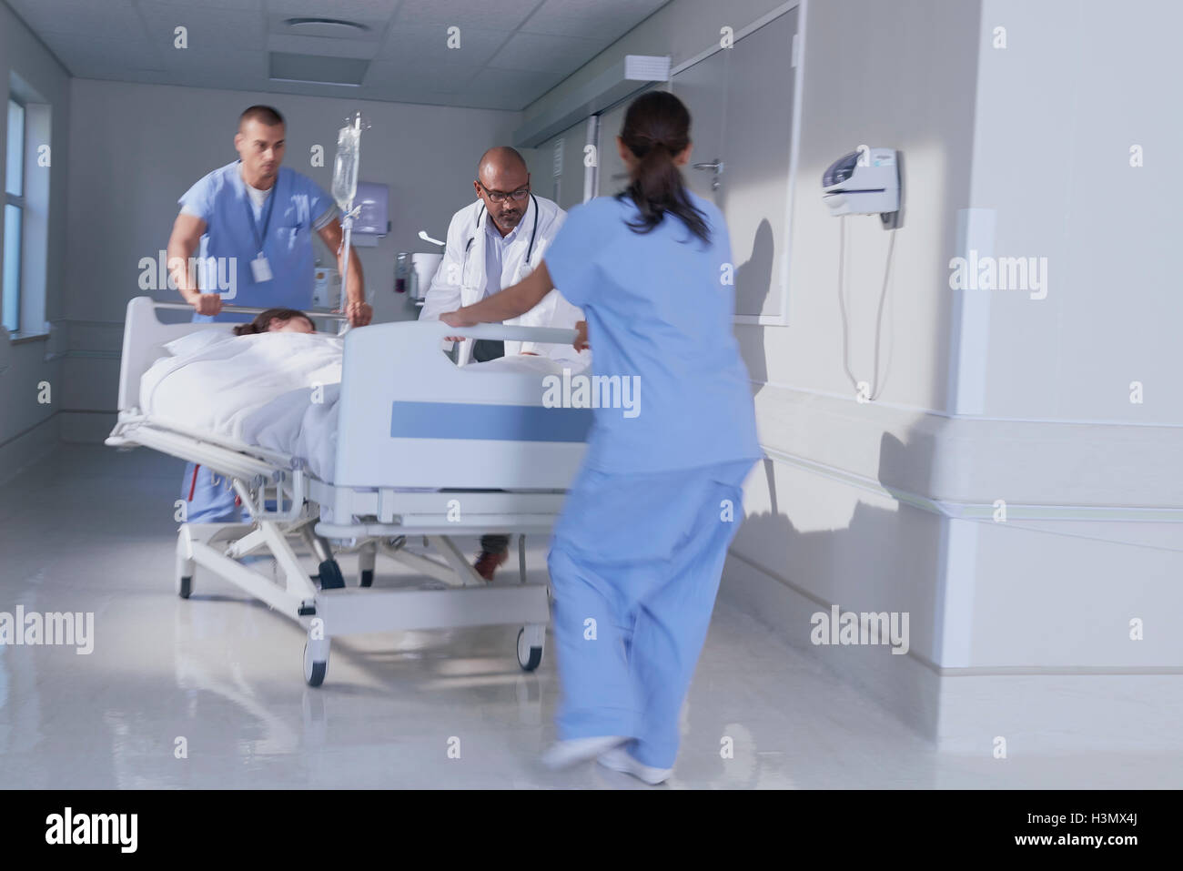 Doctor and medical running with patient bed in hospital emergency Stock ...