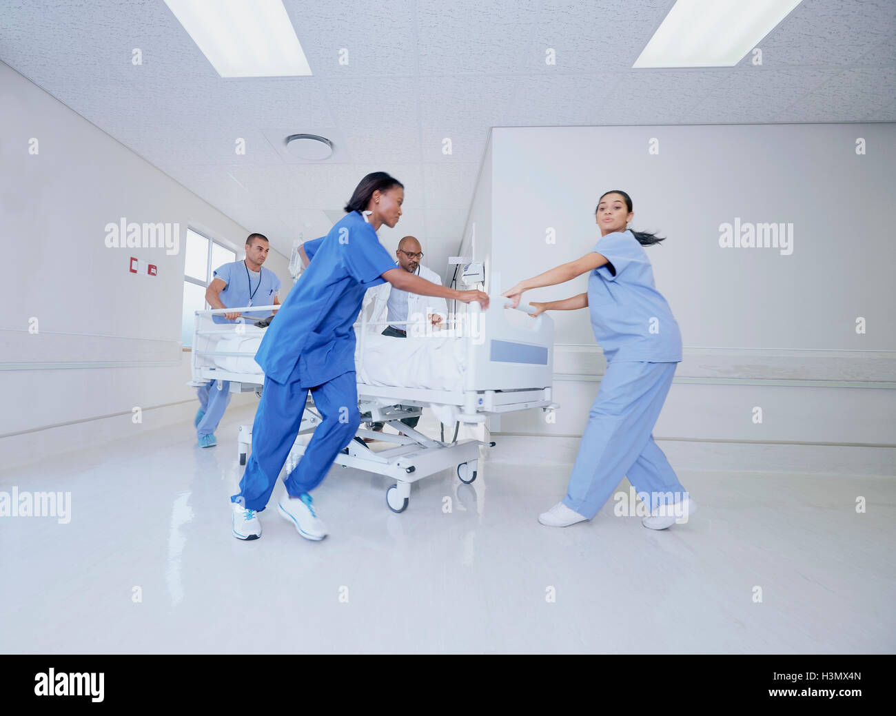 Doctor and medical running with patient bed in hospital emergency Stock ...