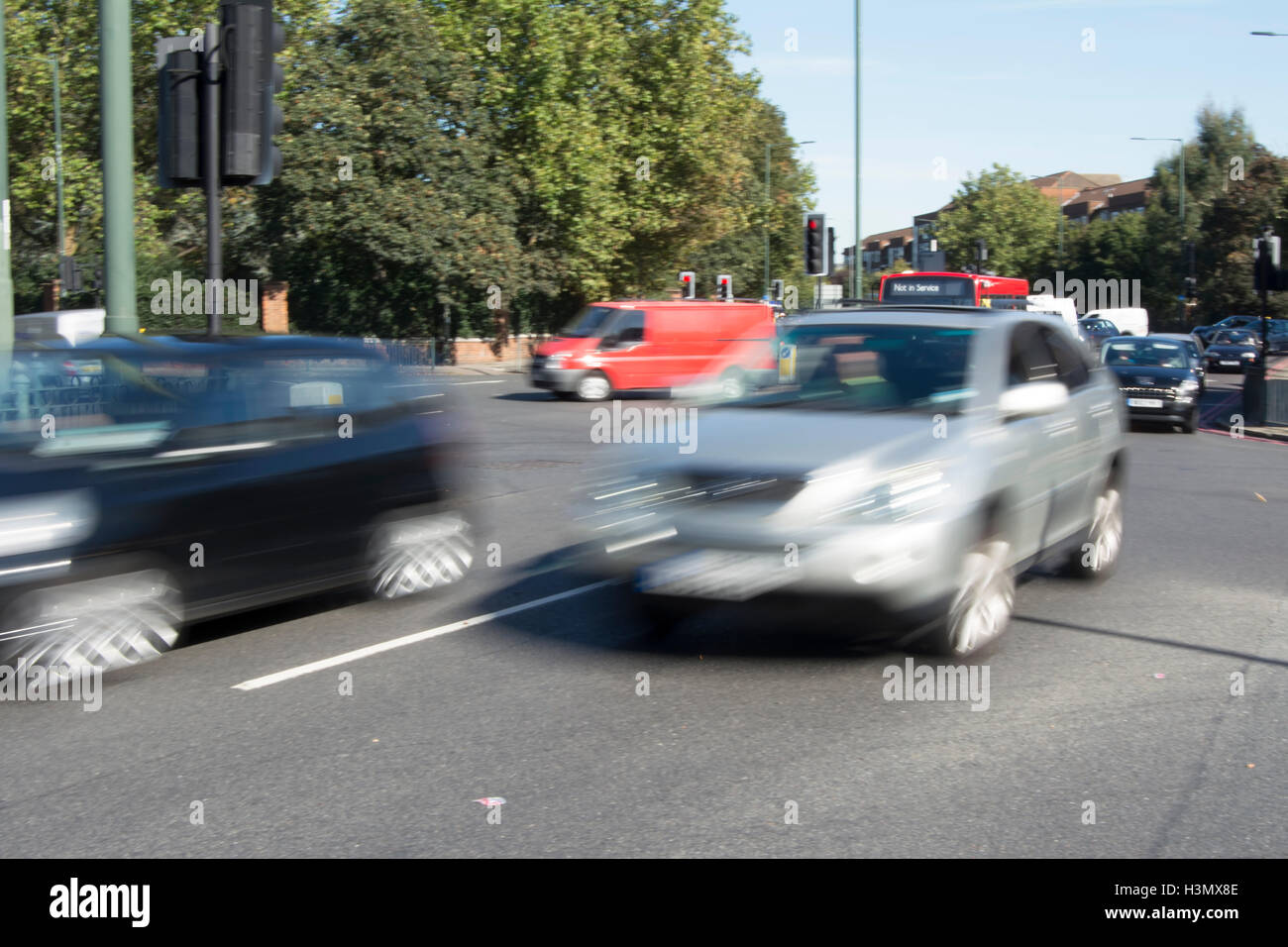 vehicles seen in blurred motion crossing chalkers corner, a major road ...