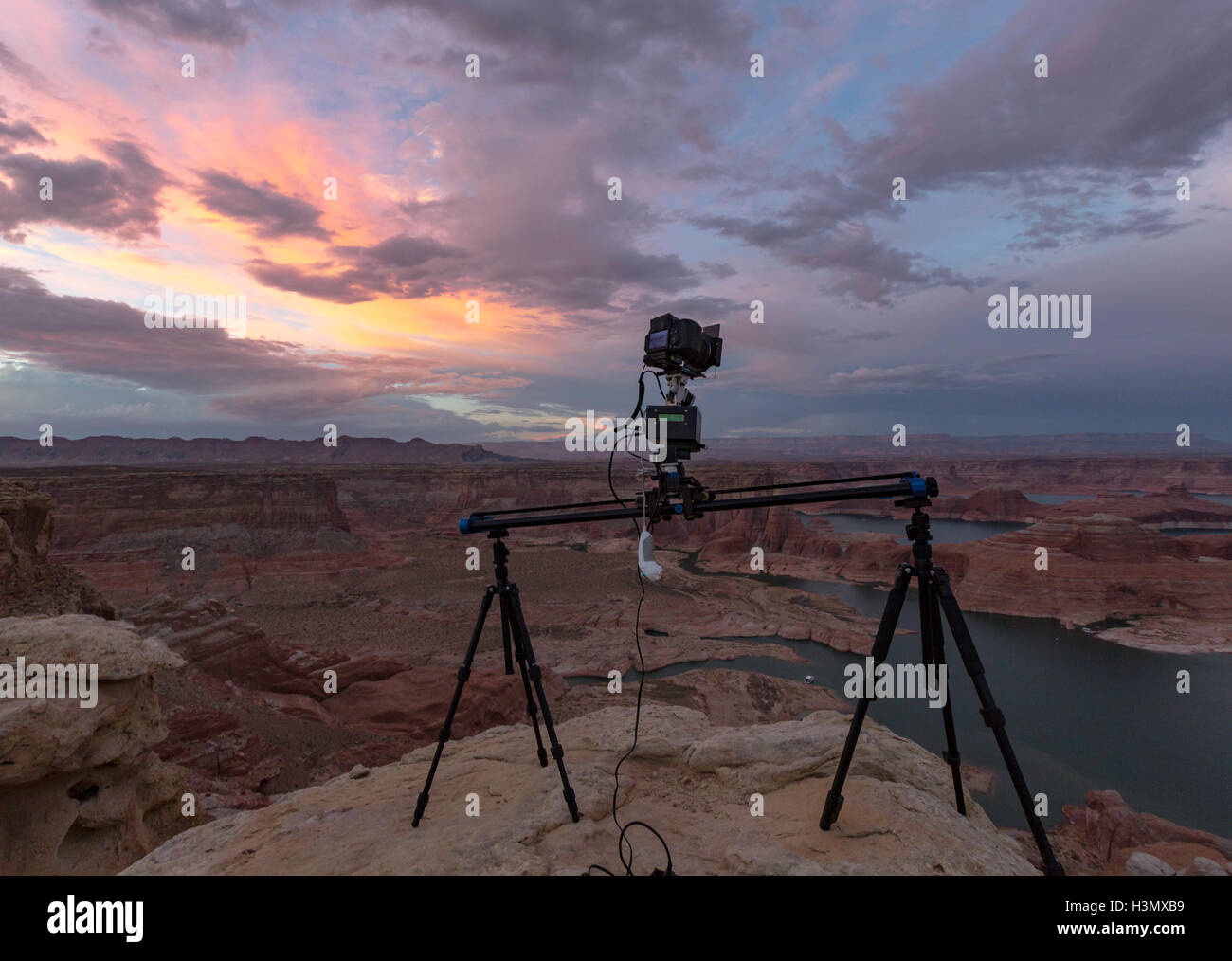 Camera on tripods photographing view of Lake Powell and canyons ...