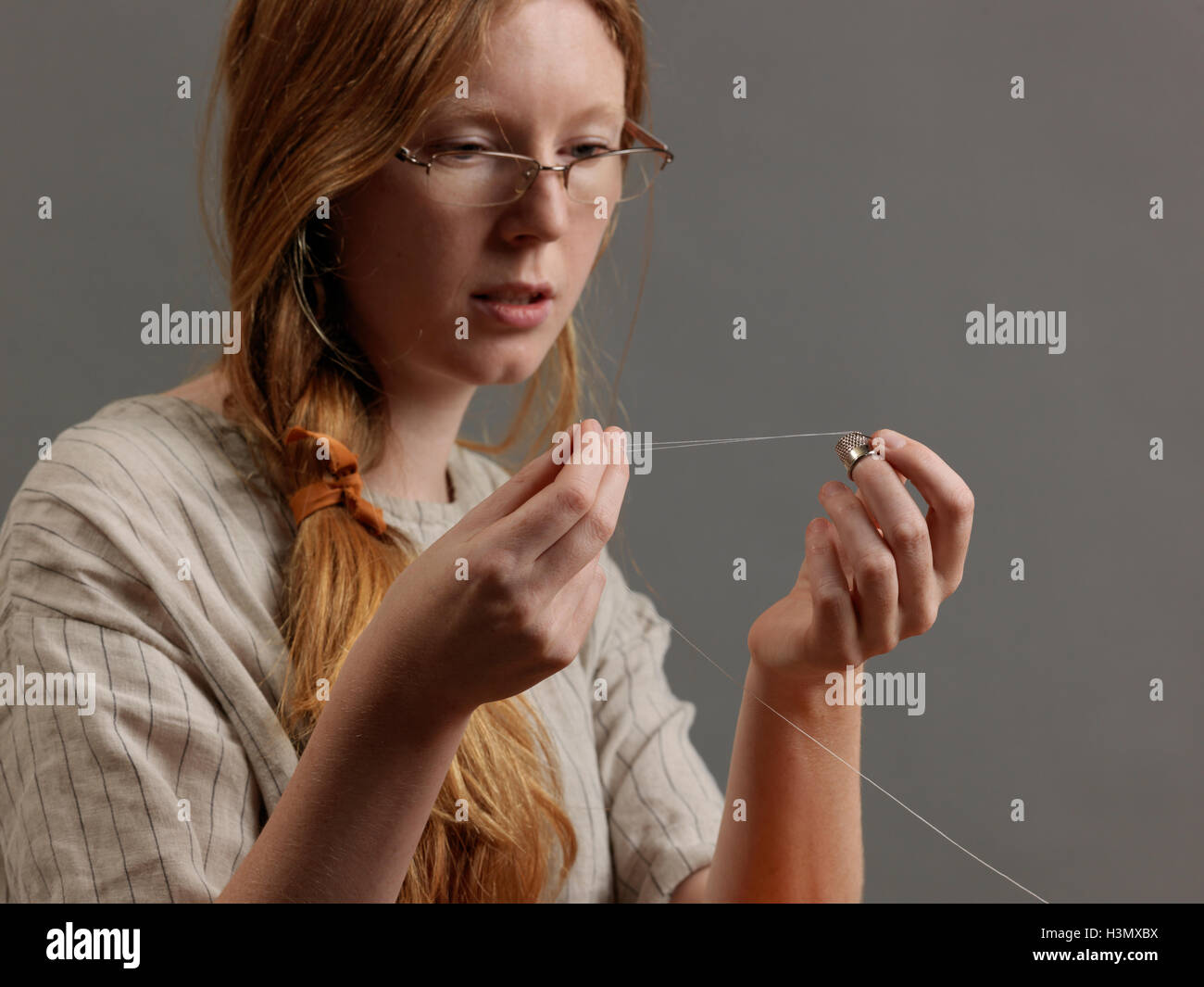 Threading needle hi-res stock photography and images - Alamy