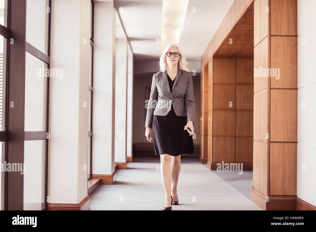 Woman walking office one person hi-res stock photography and images - Alamy
