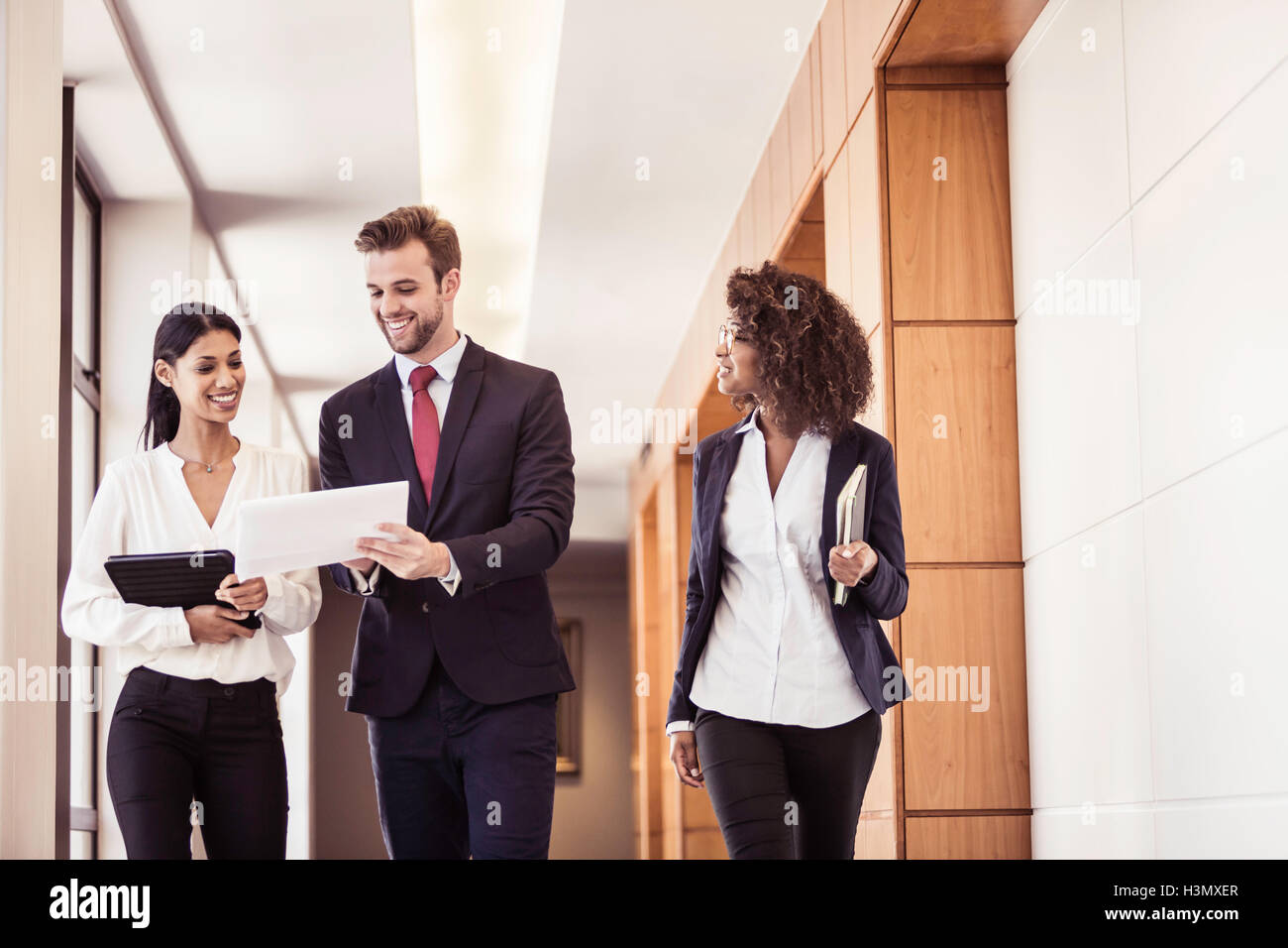 Businesswomen walking in office hi-res stock photography and images - Alamy
