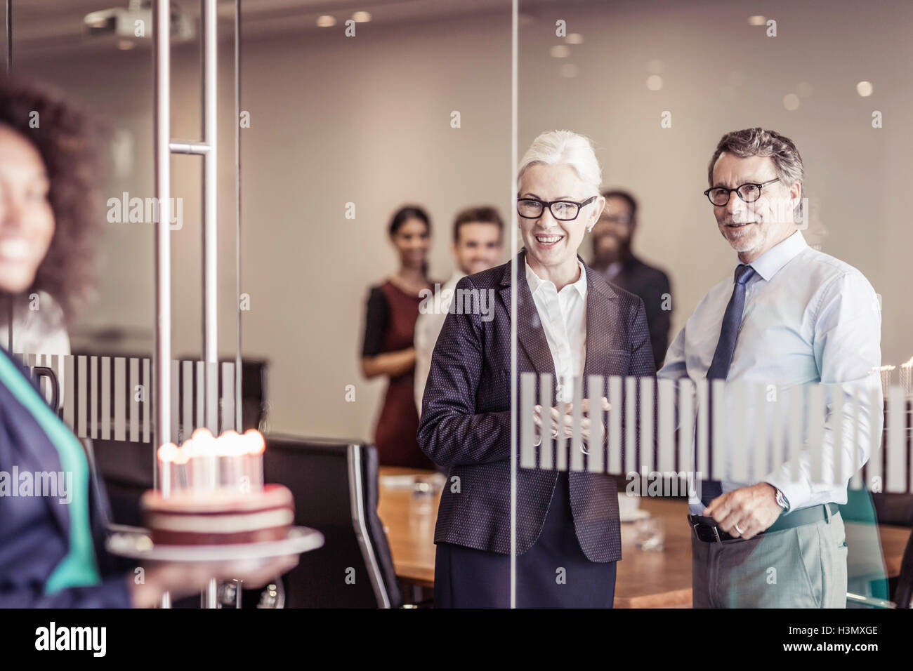 Woman presenting birthday cake hi-res stock photography and images - Alamy