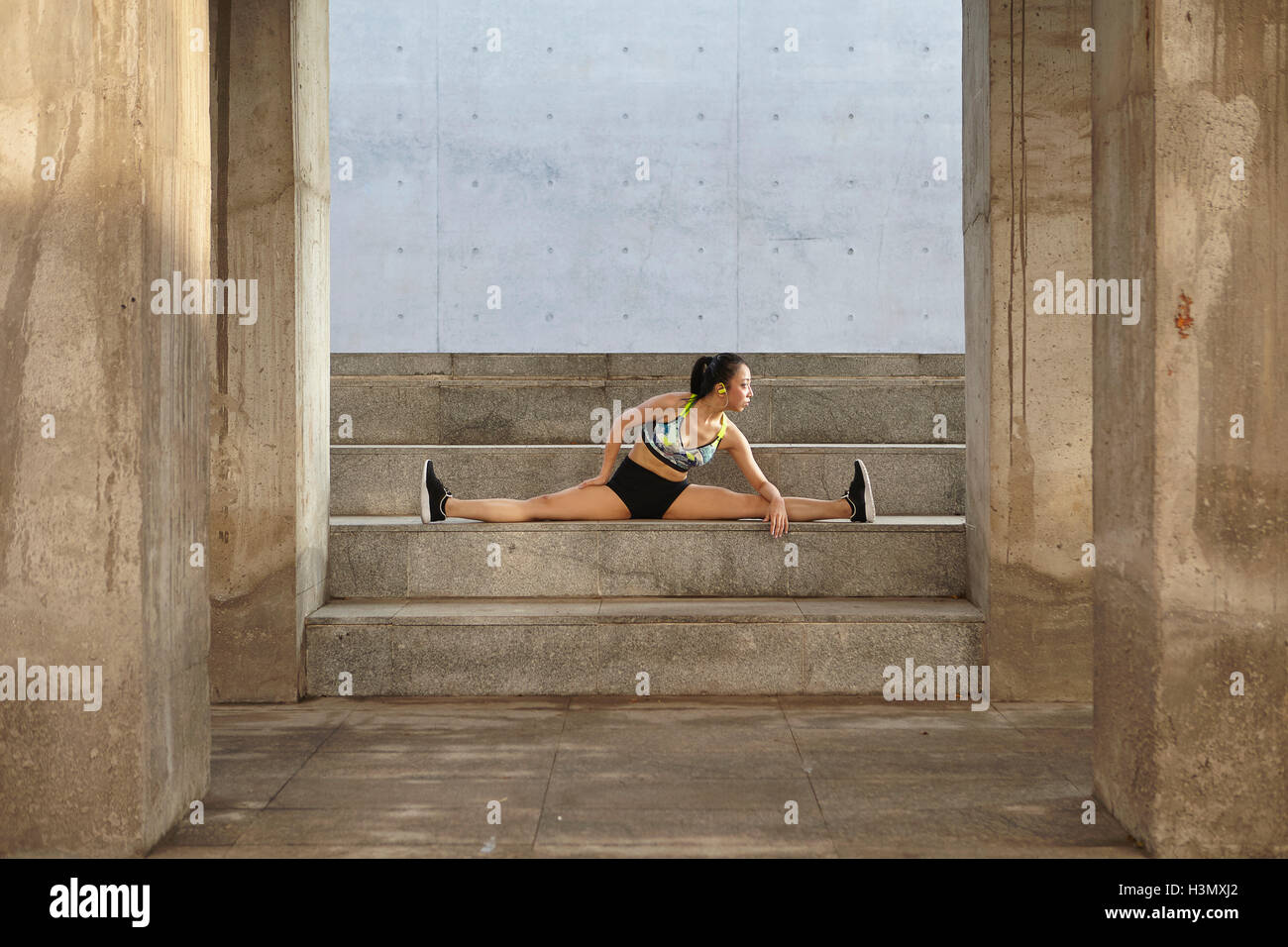 Woman doing splits on steps Stock Photo - Alamy