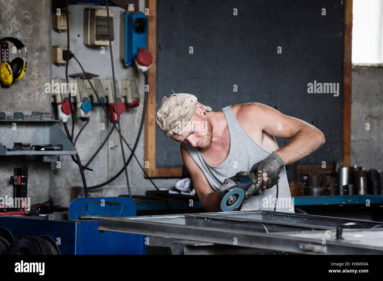 Young carpenter wearing cap hi-res stock photography and images - Alamy
