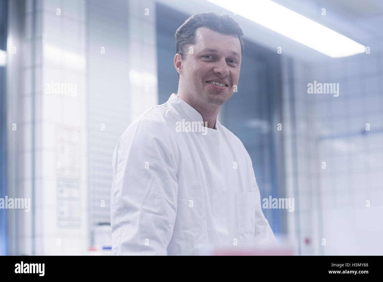 Happy scientist in laboratory Stock Photo - Alamy