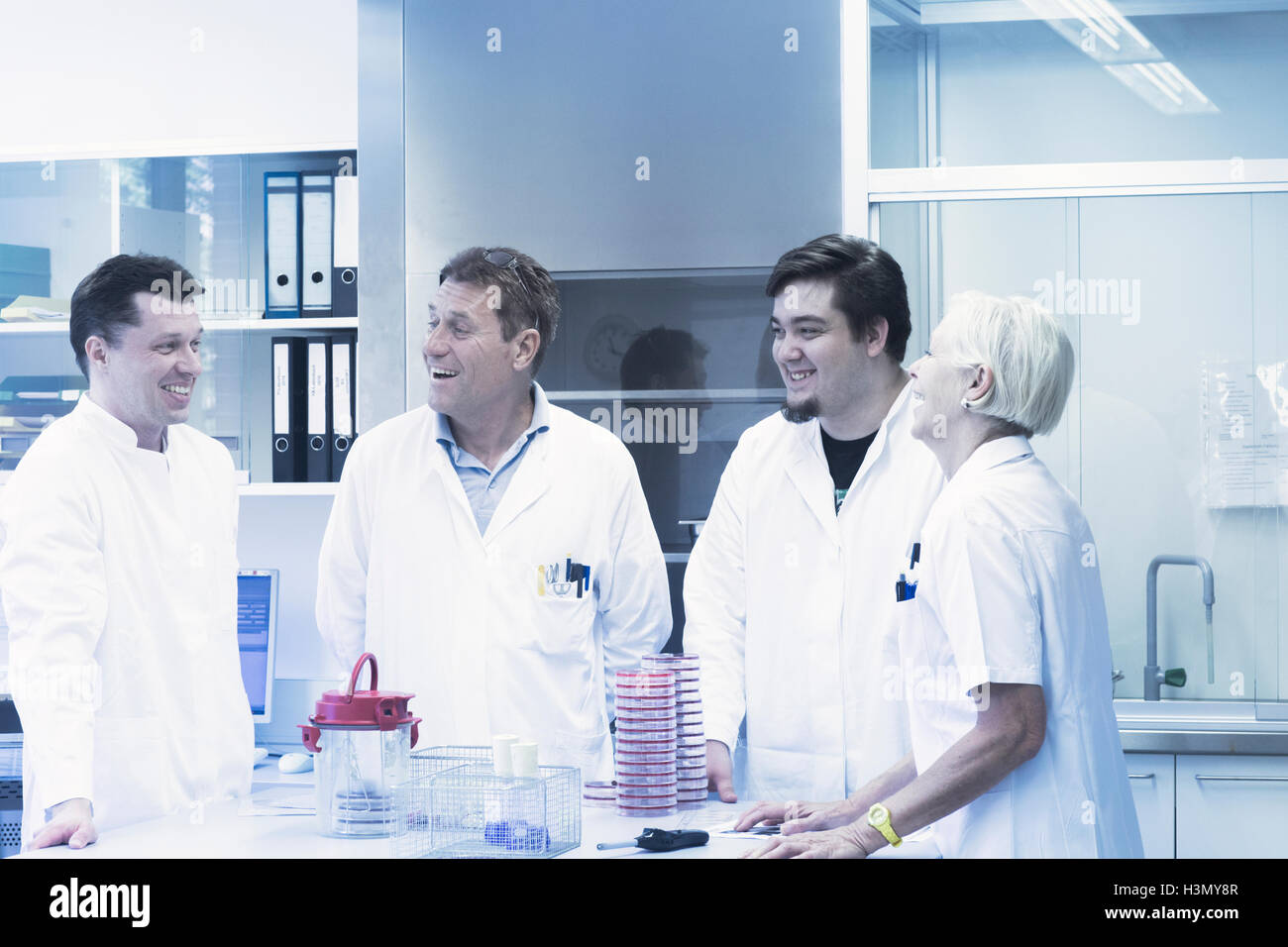 Scientists laughing in laboratory Stock Photo - Alamy
