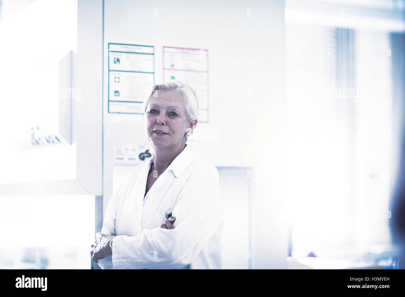 Happy scientist in laboratory Stock Photo - Alamy