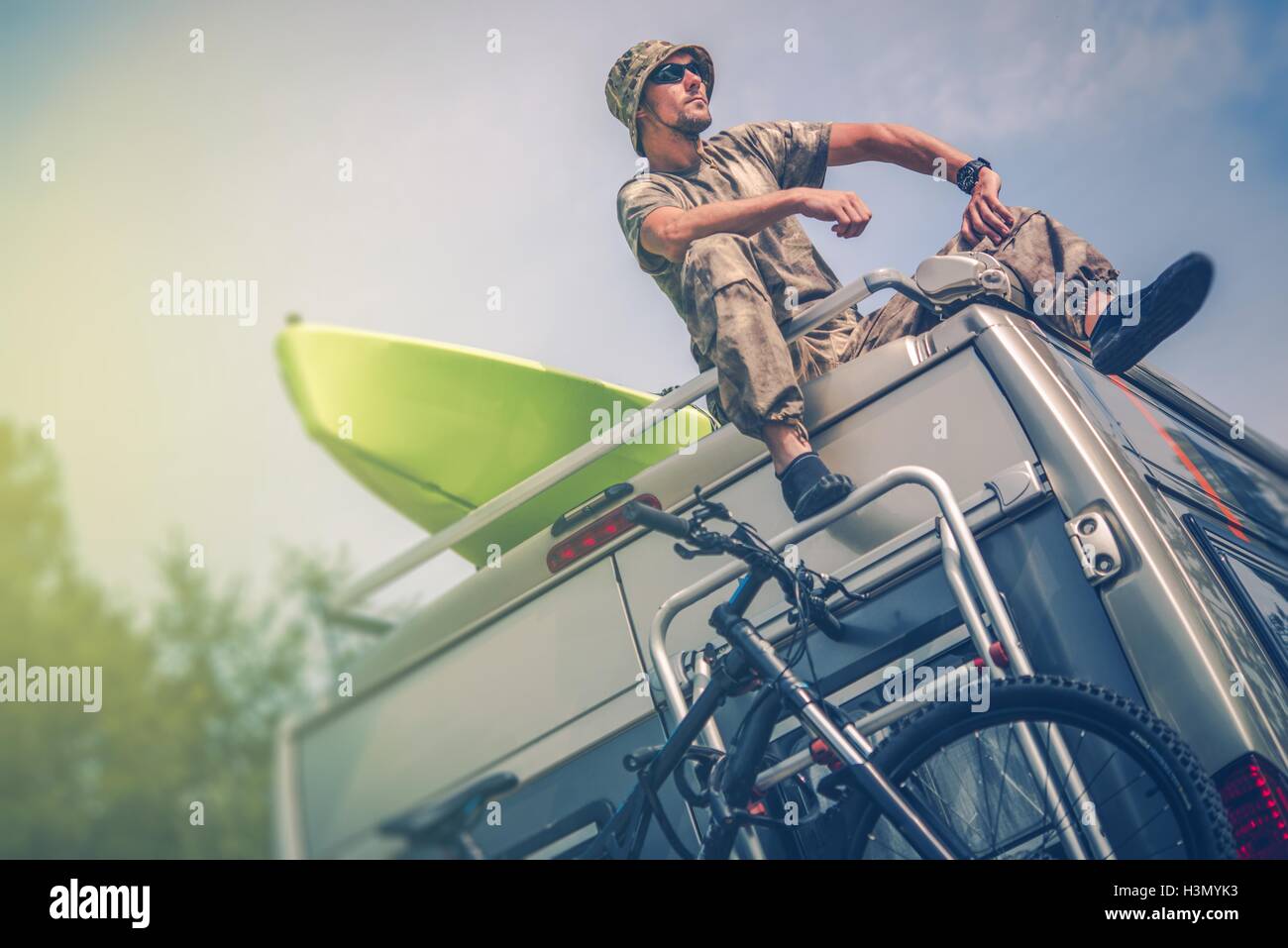 The Ultimate Outdoor Man. Caucasian Men Relaxing While Seating on the ...