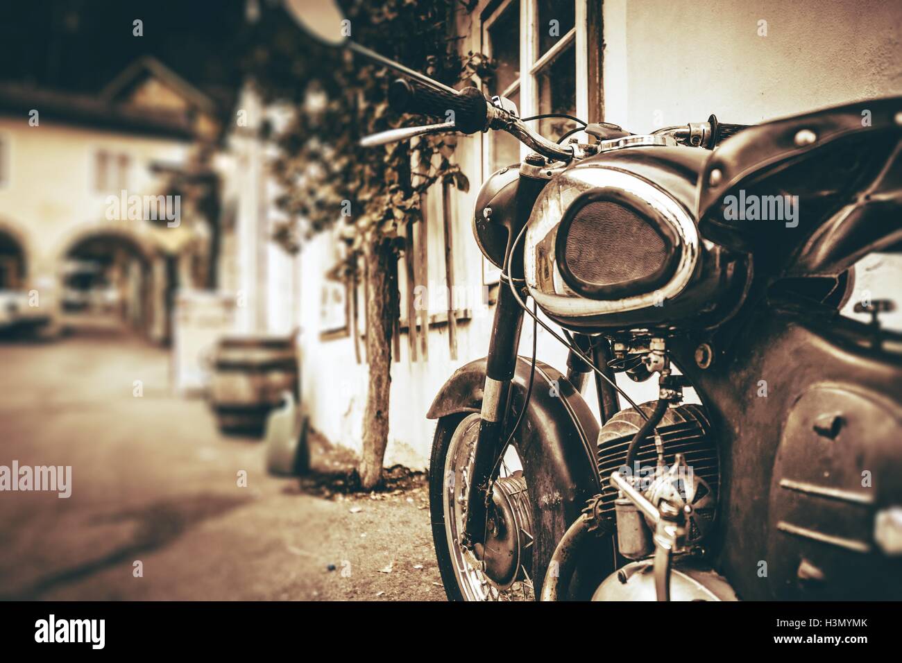 Vintage Motorcycle Closeup. Parked Aged Motorcycle in the Small ...