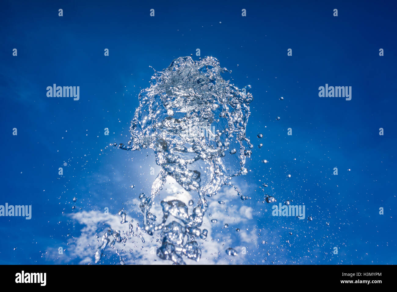 Stream of water divided into many droplets Stock Photo - Alamy