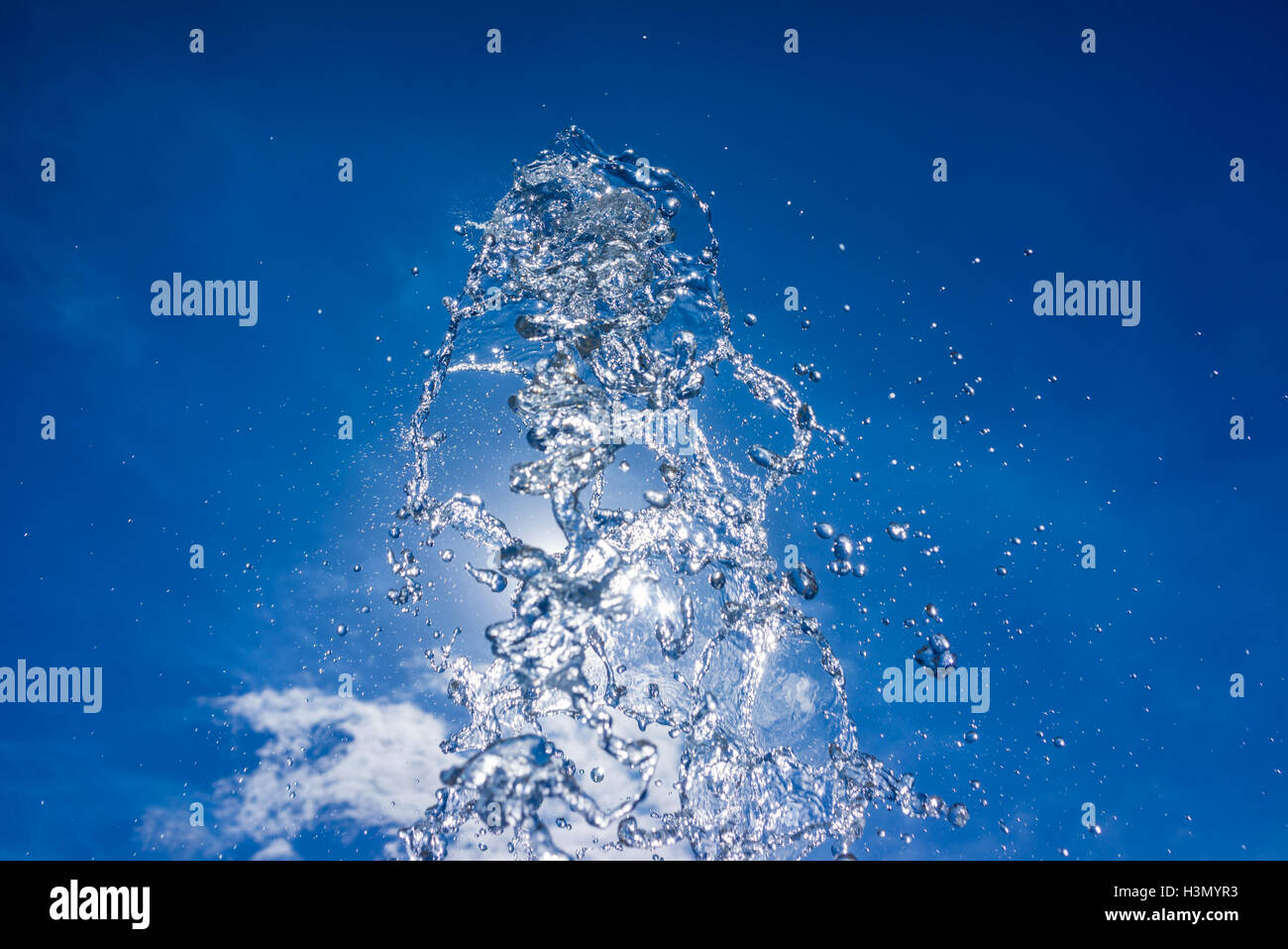 Stream of water divided into many droplets Stock Photo - Alamy