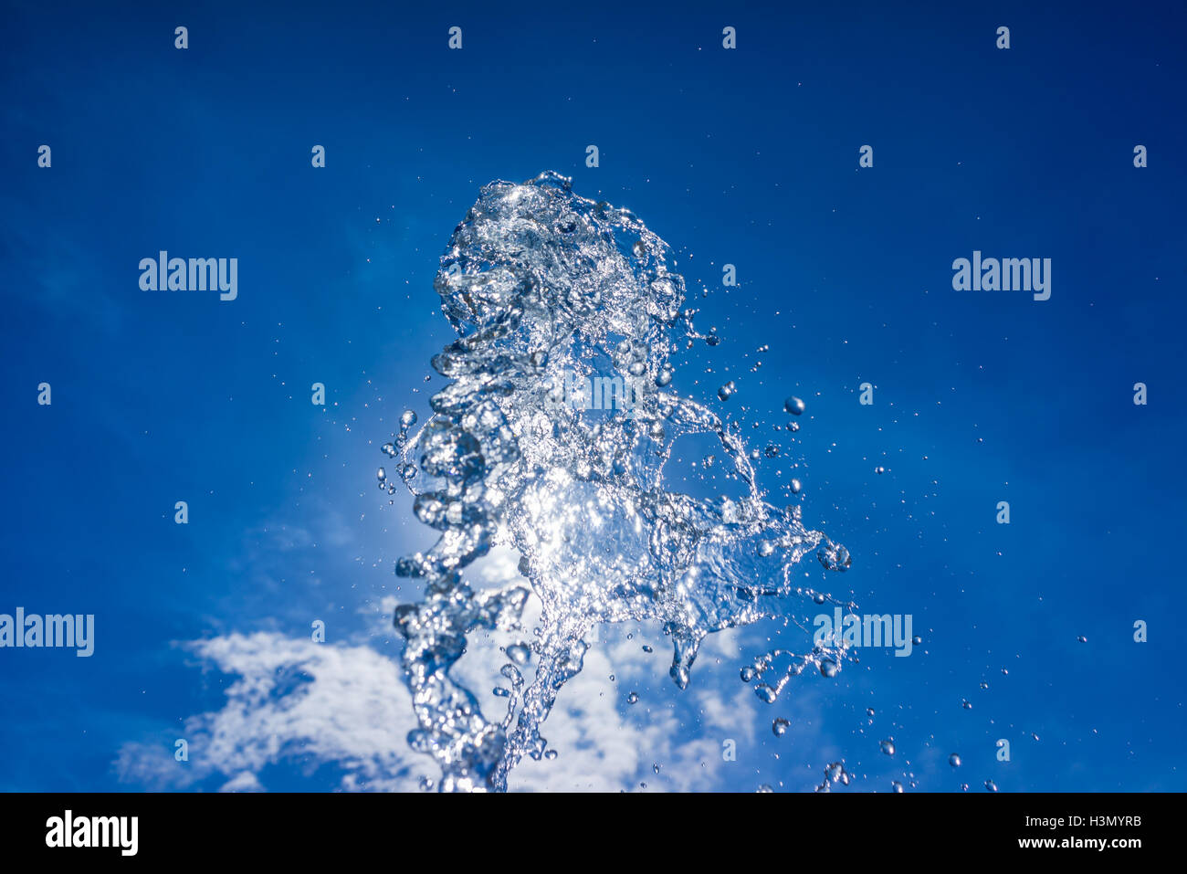 Stream of water divided into many droplets Stock Photo - Alamy