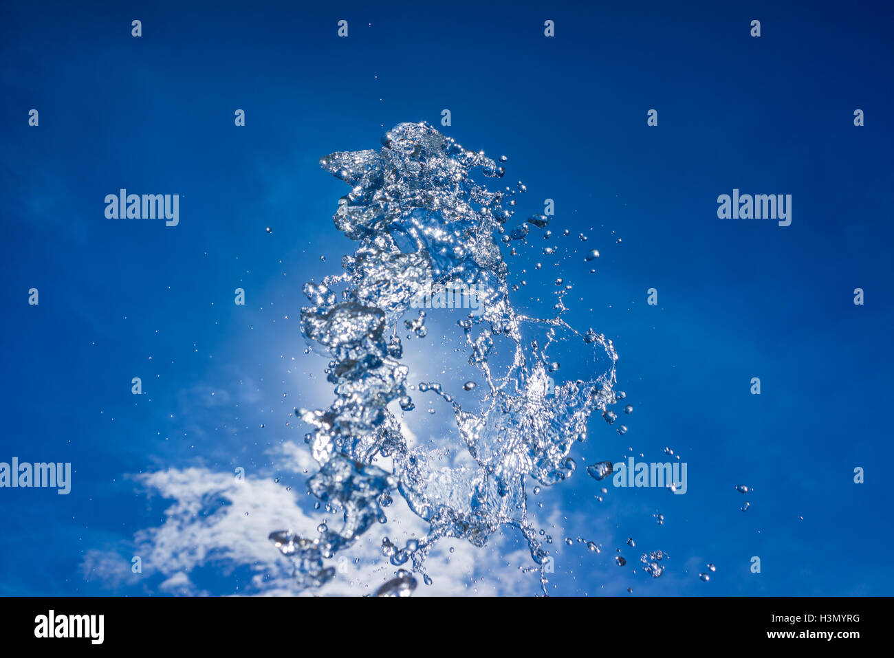 Stream of water divided into many droplets Stock Photo - Alamy