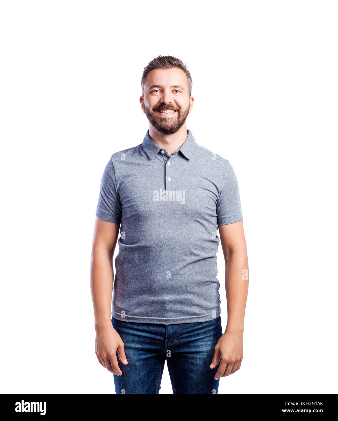 Hipster man in gray t-shirt. Studio shot, isolated Stock Photo - Alamy