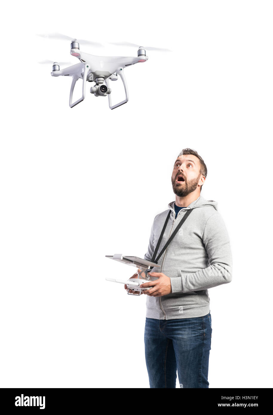 Man with flying drone. Studio shot on white background, isolated Stock ...