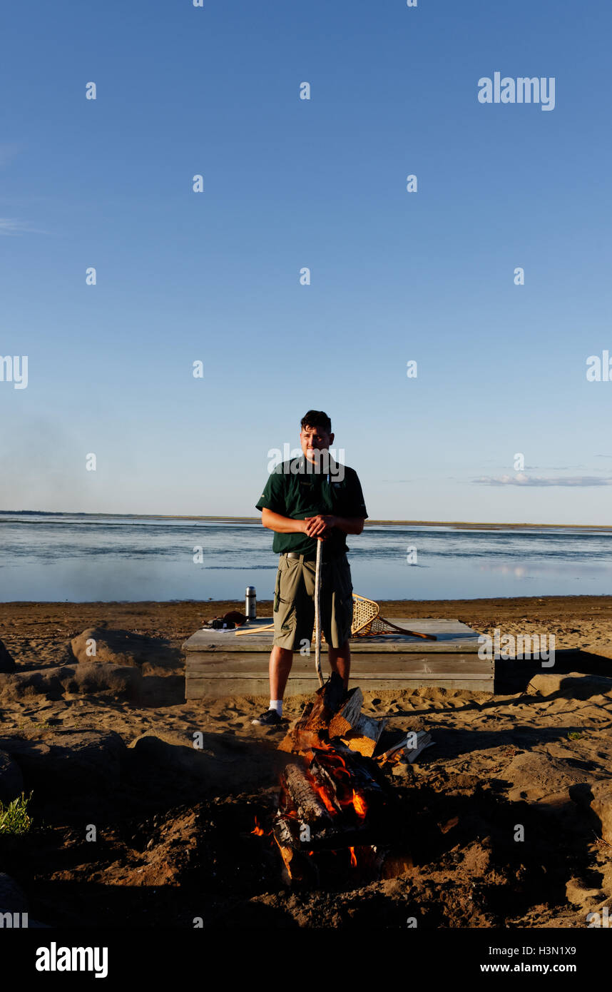 Canadian National Park rangers giving a speech by a campfire in ...