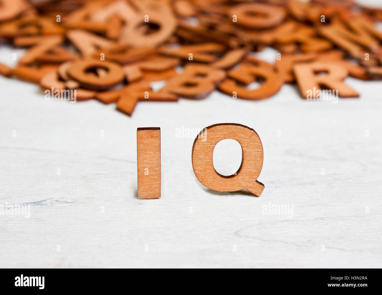 Word IQ (Intelligence quotient ) made with wooden letters on a ...