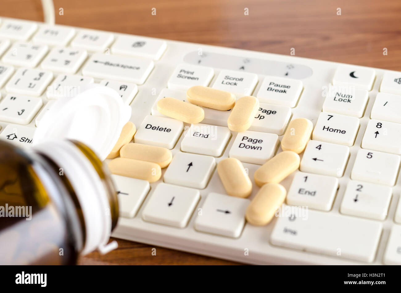 pills on keyboard computer Stock Photo - Alamy