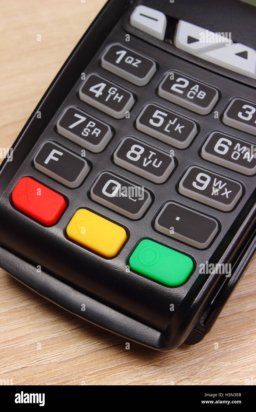 Credit card reader on wooden desk, payment terminal, finance and ...