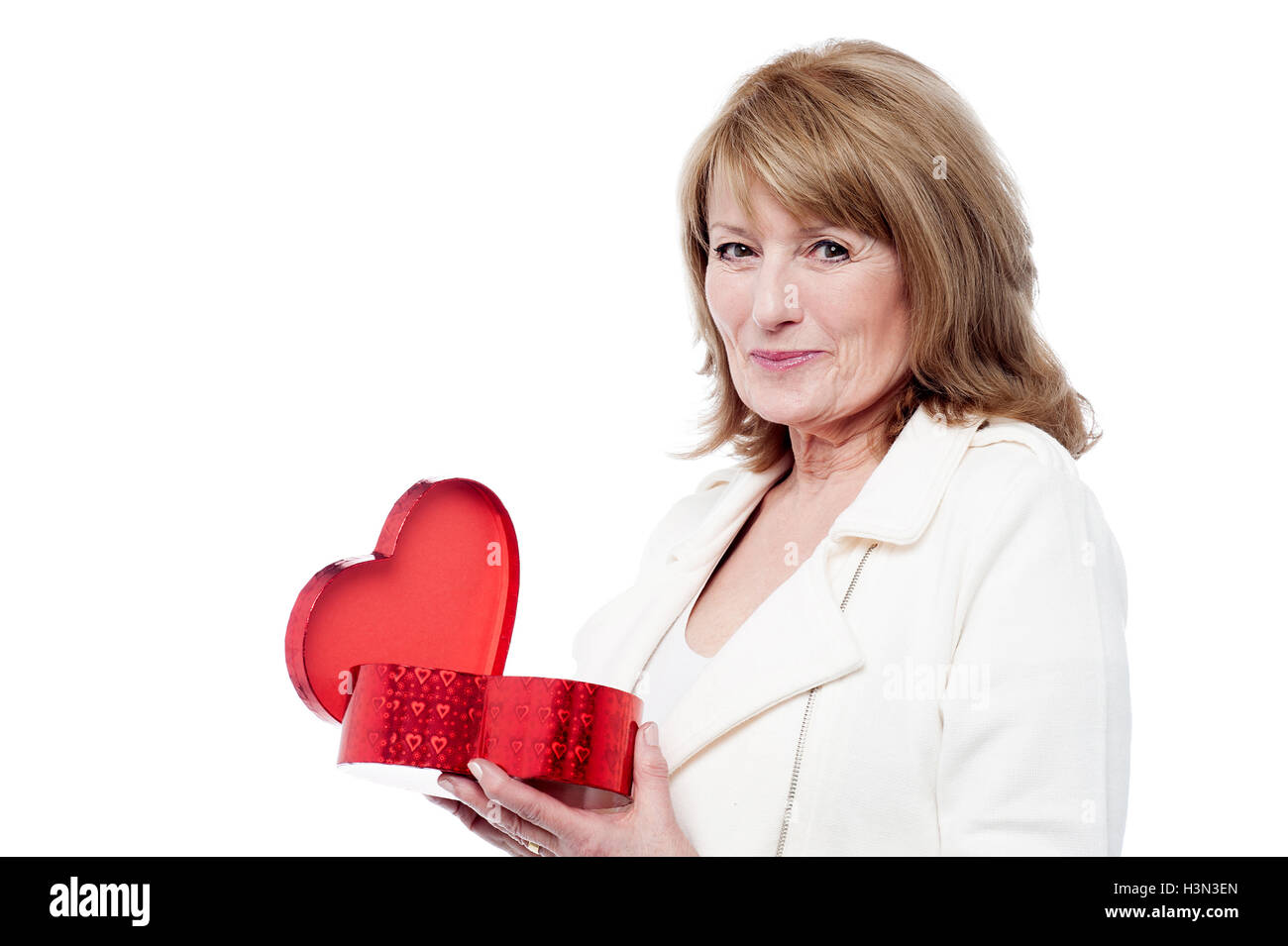 Lady opening heart shaped gift box Stock Photo - Alamy