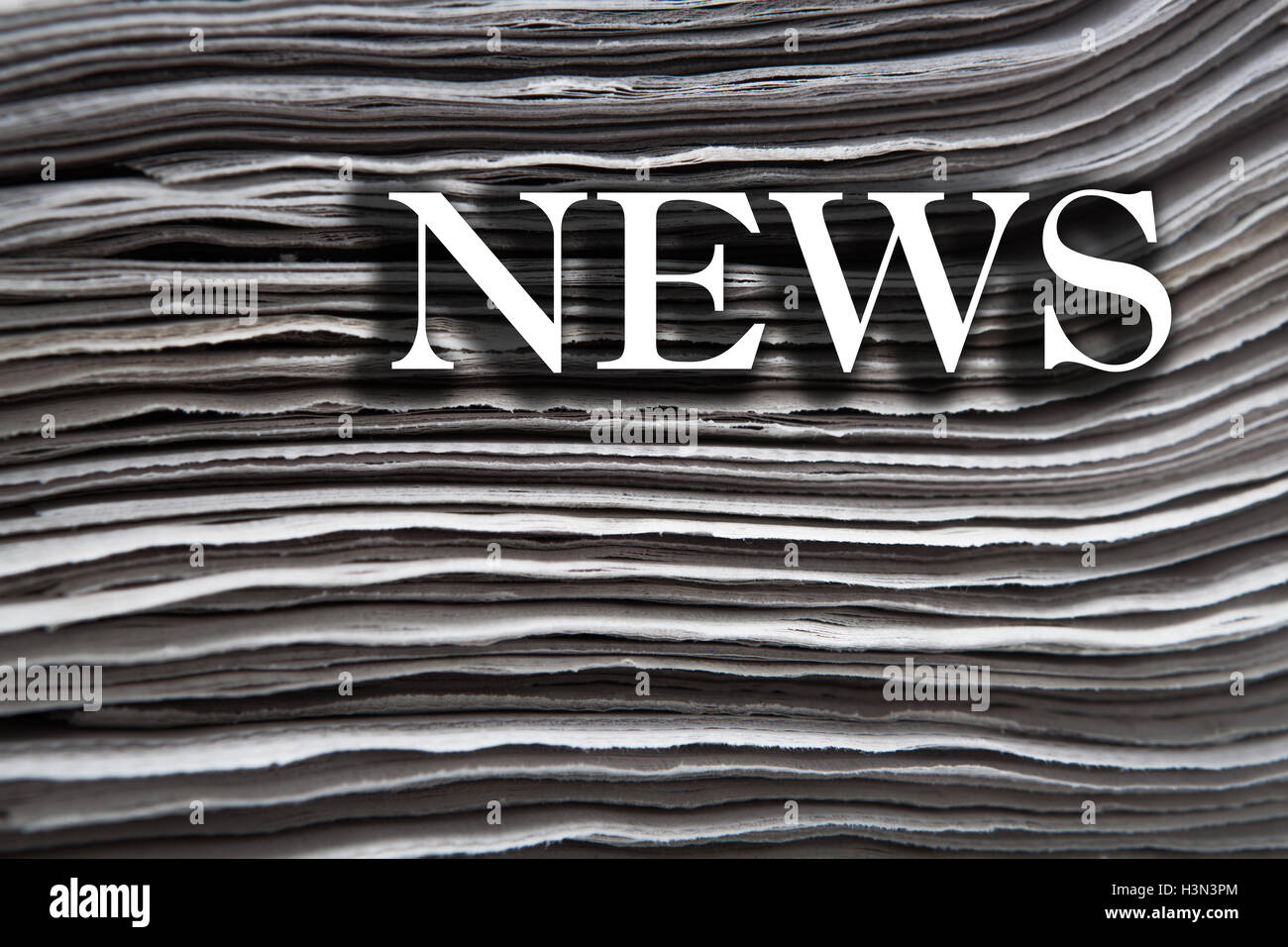 stack of newspapers closeup Stock Photo - Alamy