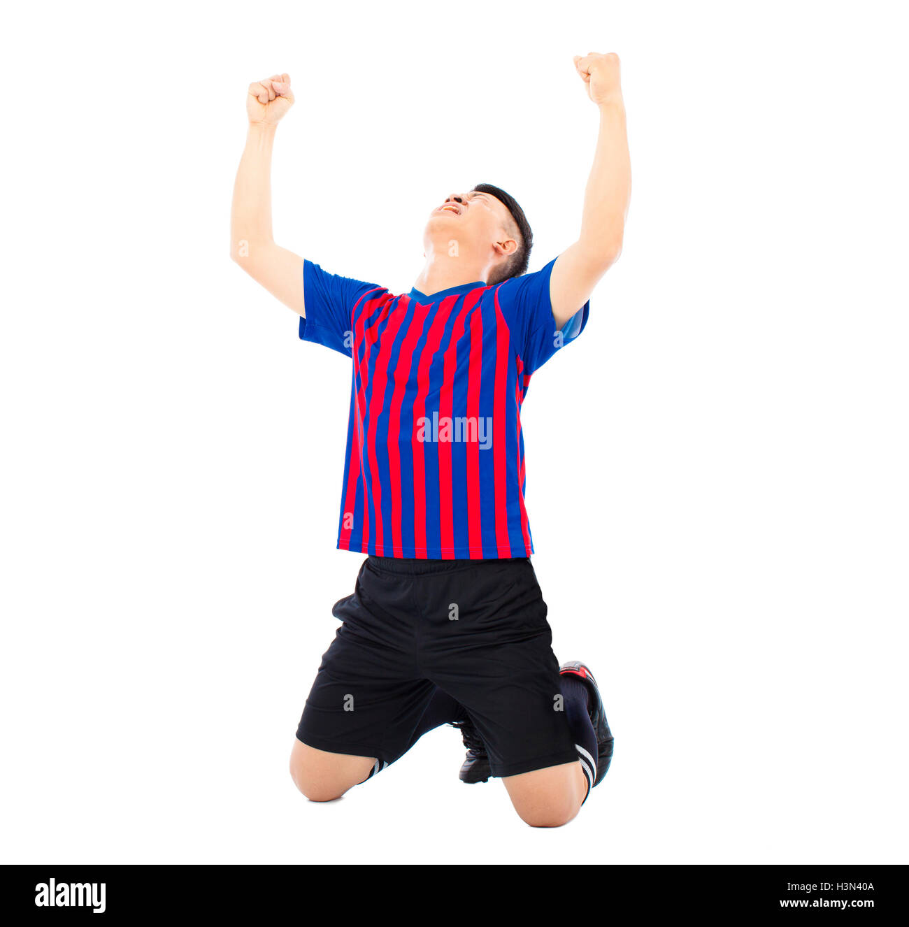 young soccer player and raised hands to celebrate winner Stock Photo ...