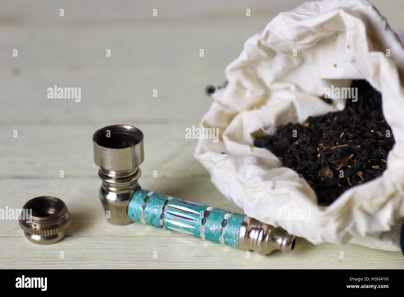 small marijuana pipe on white background Stock Photo - Alamy