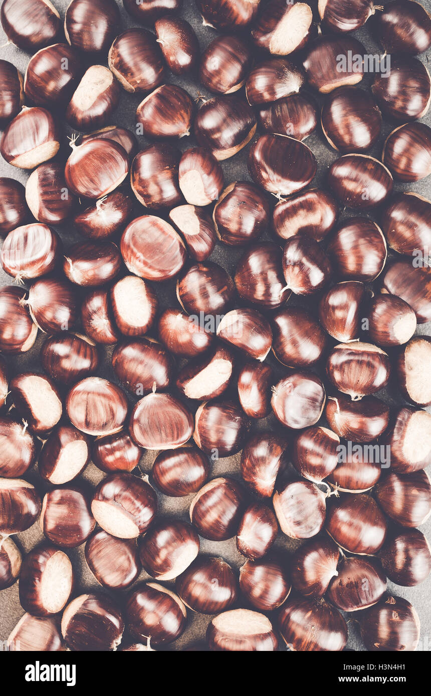 ripe chestnuts on a slate background - seasonal fruits Stock Photo - Alamy
